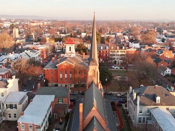 Frederick's historic downtown glows with charm at sunset. Where church spires and brick buildings create affordable retirement magic!