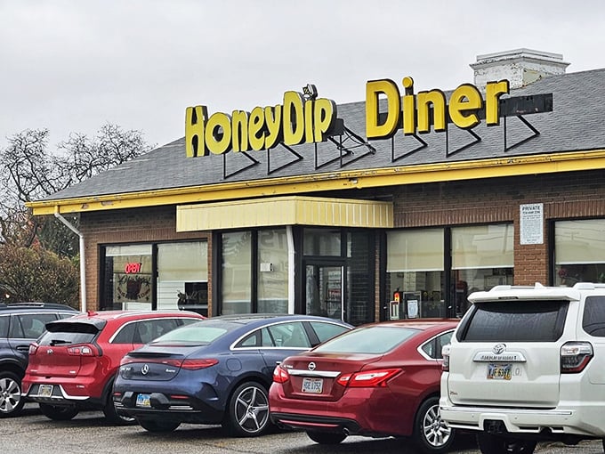 HoneyDip's cheerful yellow sign brightens even the cloudiest Ohio day, promising donuts worth the detour.