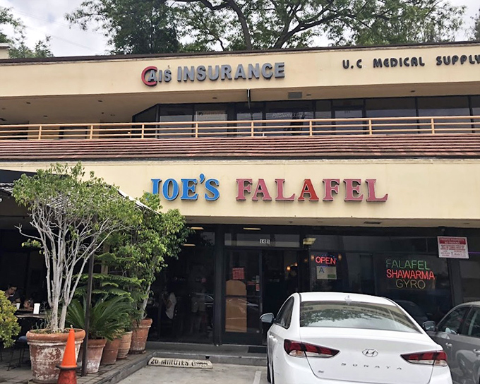 Joe's Falafel shares strip mall space with insurance offices, but the real security comes from knowing great shawarma awaits.