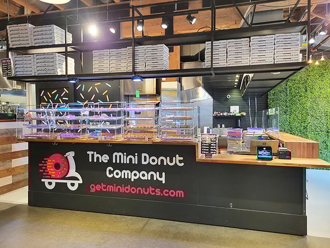 The Mini Donut Company's sleek counter showcases tiny treasures. These bite-sized beauties prove good things come in small packages.