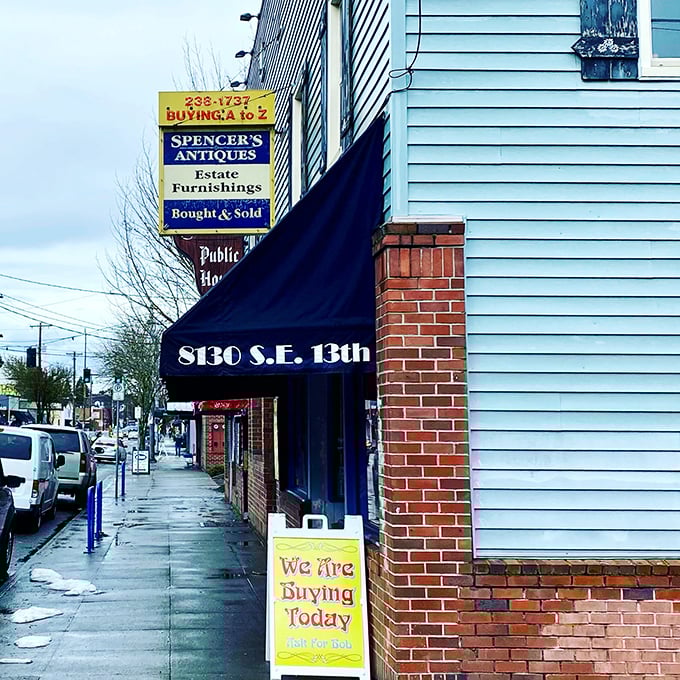 Blue building, big possibilities! R. Spencer's charming storefront sits ready to both buy and sell treasures on this bustling Portland street.