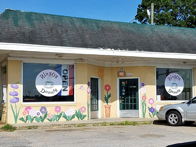 Ringo's cheerful yellow building with whimsical flower art – like your favorite aunt opened a donut shop and poured her heart into it.