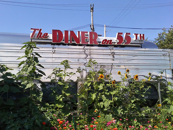 Sunflowers and stainless steel&mdash;an unexpected garden frames this classic diner. Nature meets nostalgia in perfect harmony.