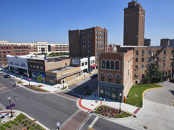 Aurora's downtown corridor welcomes visitors with wide streets and historic buildings. The traffic lights say stop, but the architecture says "stay awhile!"