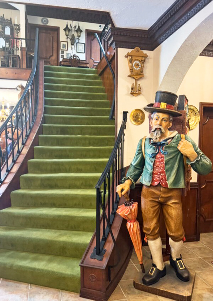 Wooden stairs and carved figures welcome you to a world of hidden passages. Where's the secret bookcase? There's always a secret bookcase!