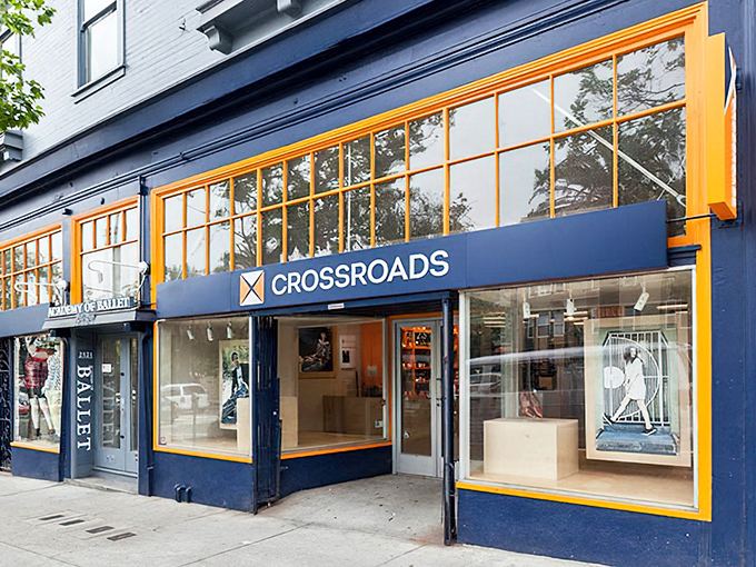 The "BUY SELL TRADE" mantra of Crossroads Trading. Fashion's circle of life happens behind those artfully decorated windows.