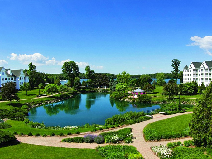 The Osthoff Resort reflects in Elkhart Lake like a postcard that somehow escaped into real life.