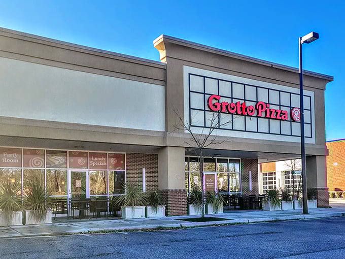 Sunlight gleams off Grotto Pizza's welcoming entrance. This Columbia spot balances modern design with timeless pizza traditions.