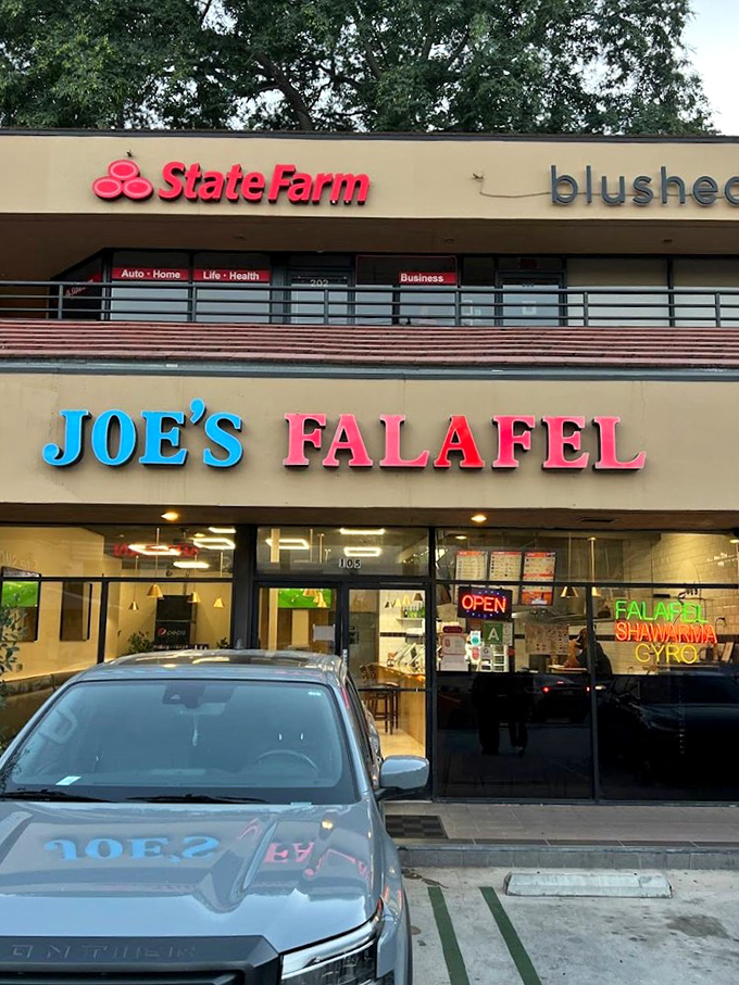 Day or night, that bright blue and pink signage guides hungry travelers to Middle Eastern flavors worth writing home about.