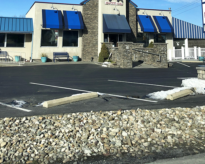 Those blue awnings might be subtle, but what's happening in Kyma's kitchen is bold, bright, and bursting with Mediterranean flavor.