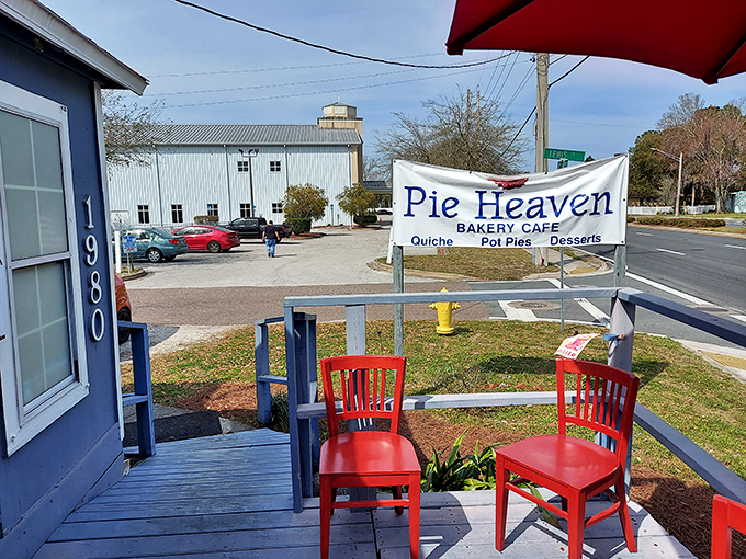 Red chairs invite you to sit a spell on Pie Heaven's porch &ndash; the perfect spot for contemplating life's sweet mysteries.