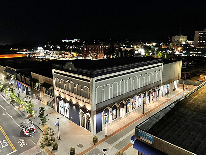 Night transforms Redding's downtown into a canvas of lights, where even practical buildings become works of illuminated art.