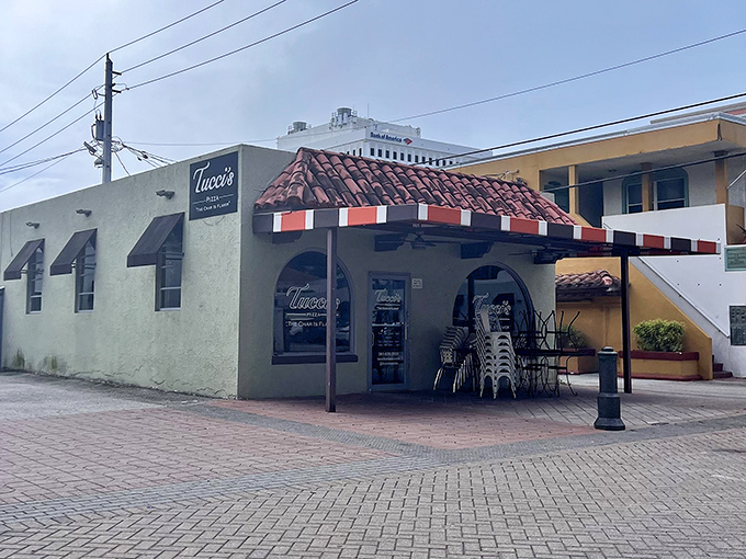 Tucci's modest exterior hides coal-fired magic inside. Those empty chairs won't stay that way for long once the lunch crowd arrives.