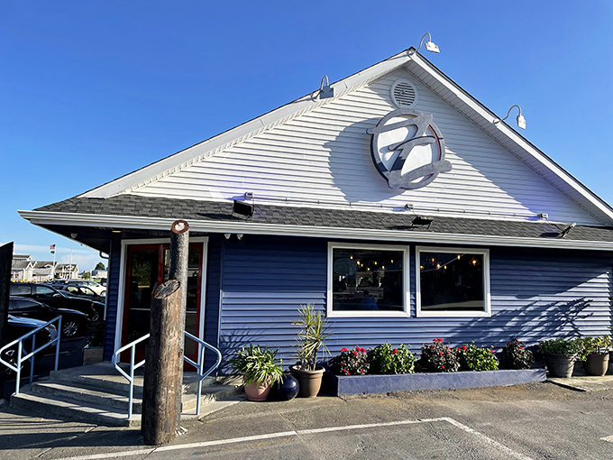 Those weathered wooden posts supporting Zola's sign have witnessed countless sunset pizza dinners with ocean breezes as the perfect seasoning.