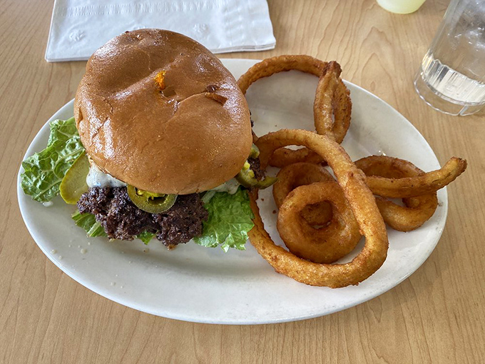 Meet the burger that doesn't need a passport to travel between your plate and food heaven. Those fries are its willing companions.