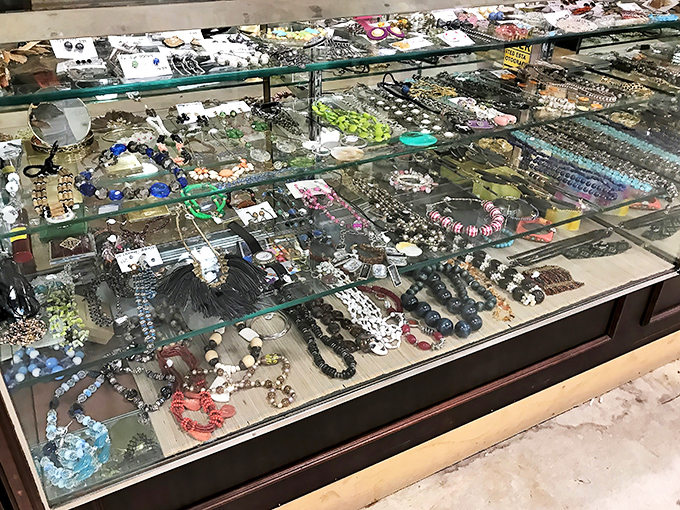 Treasure chest vibes from this jewelry case filled with baubles and beads. The thrill of discovering a genuine gem among costume pieces keeps the jewelry section perpetually busy.