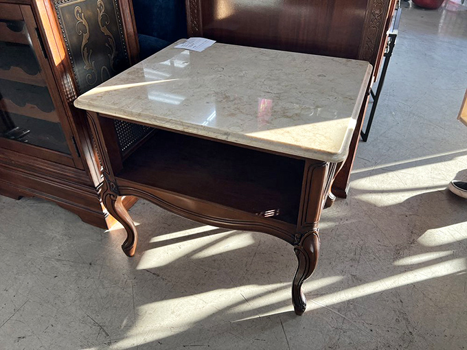 This marble-topped antique table has likely hosted everything from Victorian tea services to someone's 1970s tax paperwork.