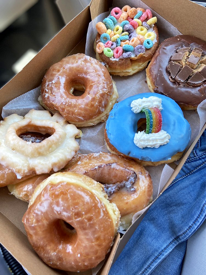 A donut box worthy of a museum exhibit. From rainbow sprinkles to chocolate glaze, this collection of circular masterpieces proves variety truly is the spice of life.