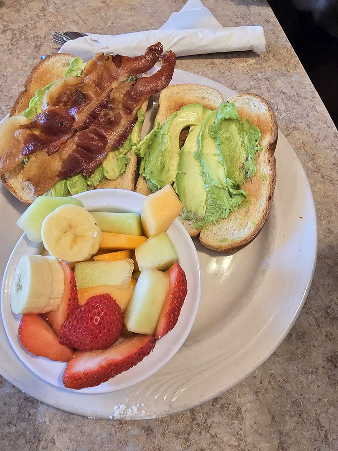 Avocado toast with a side of fresh fruit&mdash;proof that Charlie's can do contemporary California cuisine while keeping its old-school soul.