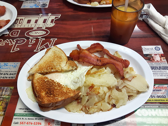 The holy trinity of breakfast: crispy bacon, golden toast, and potatoes that somehow manage to be both crispy and tender simultaneously.