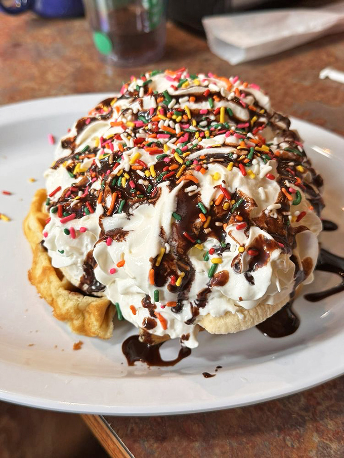 This isn't dessert, it's "breakfast dessert"&mdash;a waffle mountain topped with whipped cream, sprinkles, and permission to start your day with joy.