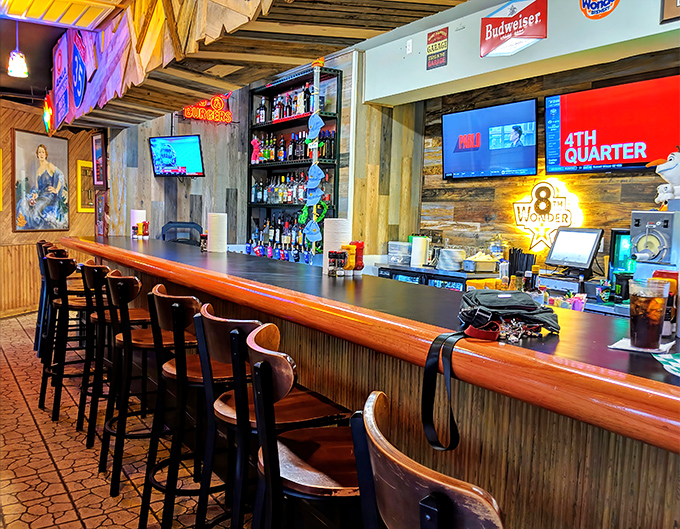 The bar area balances sports-watching practicality with enough Texas charm to make even waiting for a table feel like part of the experience.