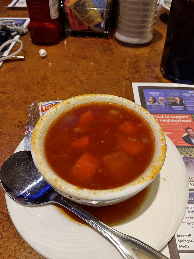A hearty vegetable soup that's clearly been simmering with purpose—each spoonful tells a story of patience and flavor.