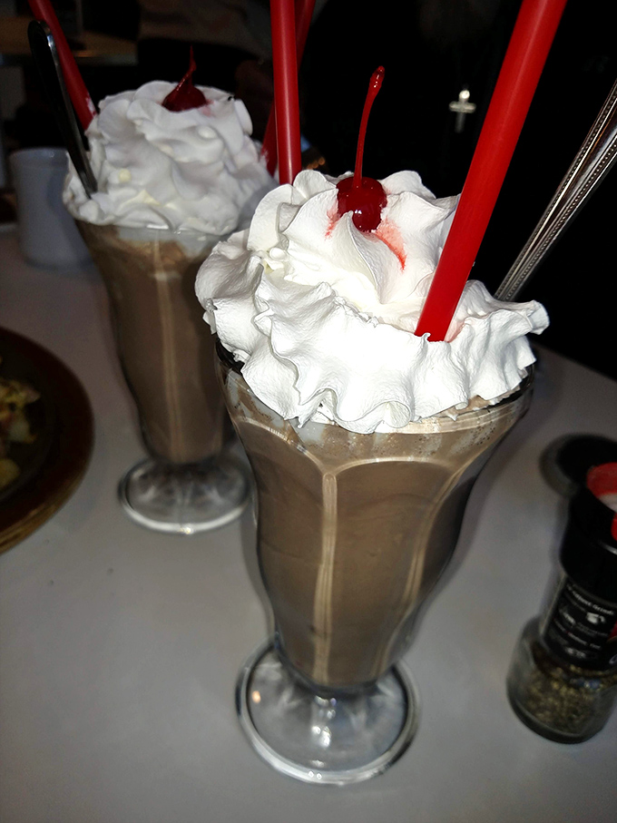 These milkshakes have more whipped cream than my childhood dreams &ndash; topped with cherries that say "yes, this is exactly what your day needed."