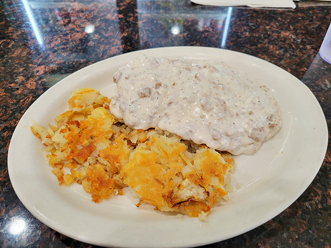 Biscuits and gravy: the breakfast equivalent of a warm hug from your favorite aunt. Those home fries are playing a delicious supporting role.