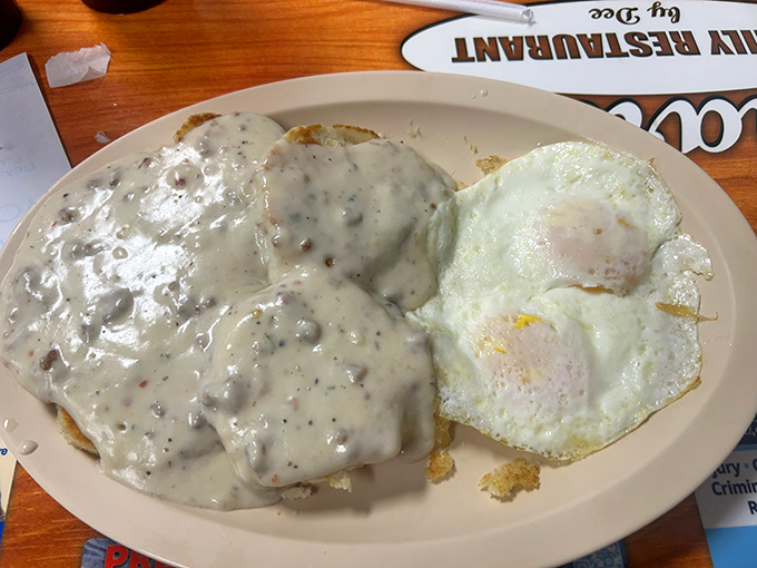 Biscuits swimming in creamy sausage gravy with sunny-side-up eggs – the breakfast equivalent of a warm hug from your favorite aunt.