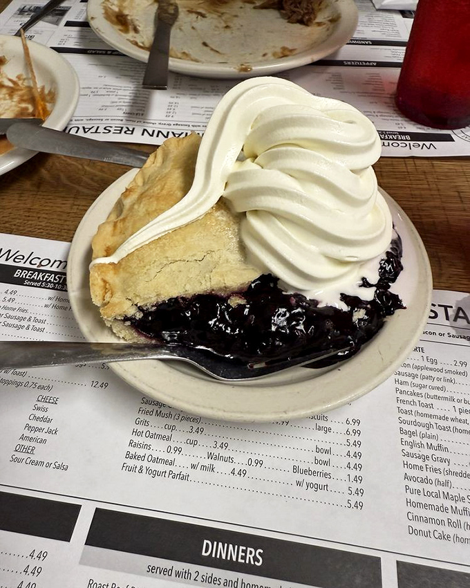 This isn't just pie – it's black raspberry therapy with a cloud of whipped cream that makes everyday troubles disappear with each forkful.