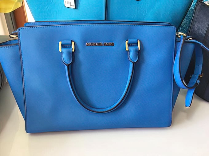 That perfect shade of blue that makes you wonder if Michael Kors somehow bottled the Mediterranean Sea into leather form.