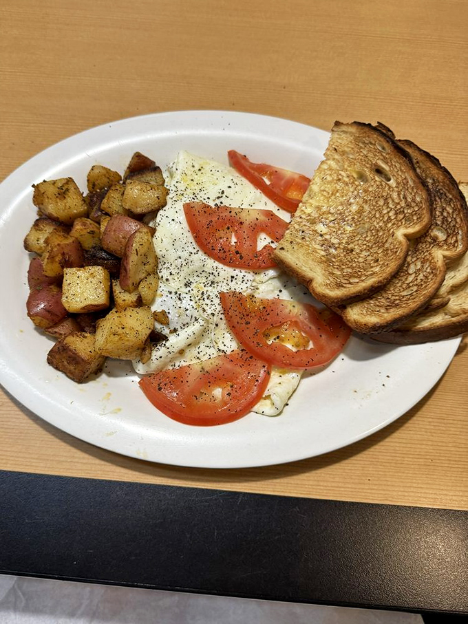 Simple perfection on a plate: eggs, crispy potatoes, and toast. Sometimes the classics need no improvement, just proper execution and respect.