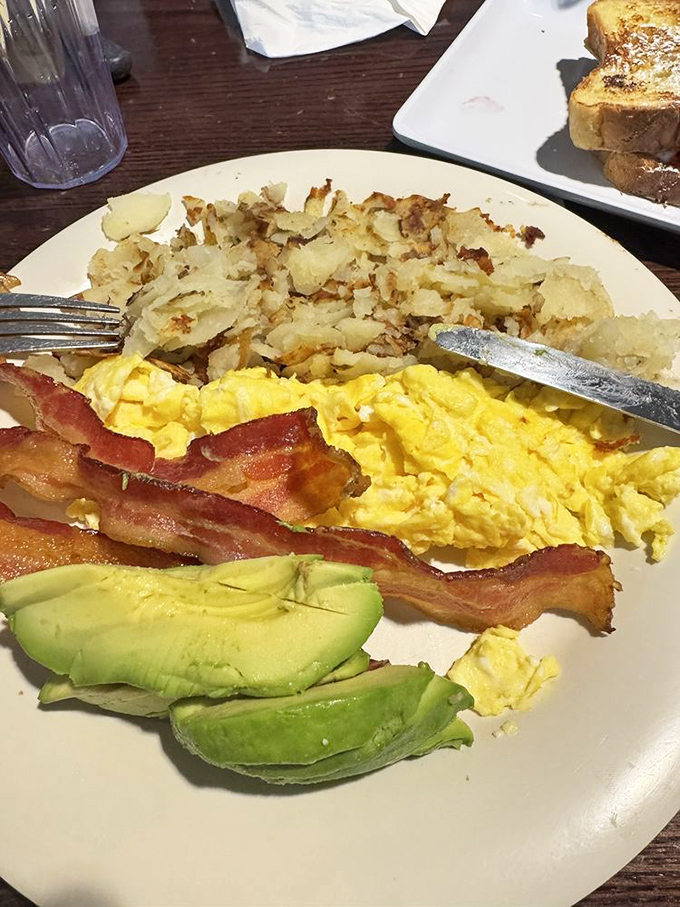 A breakfast platter so generously portioned and perfectly balanced, it transforms ordinary Tuesday mornings into celebratory weekend vibes.