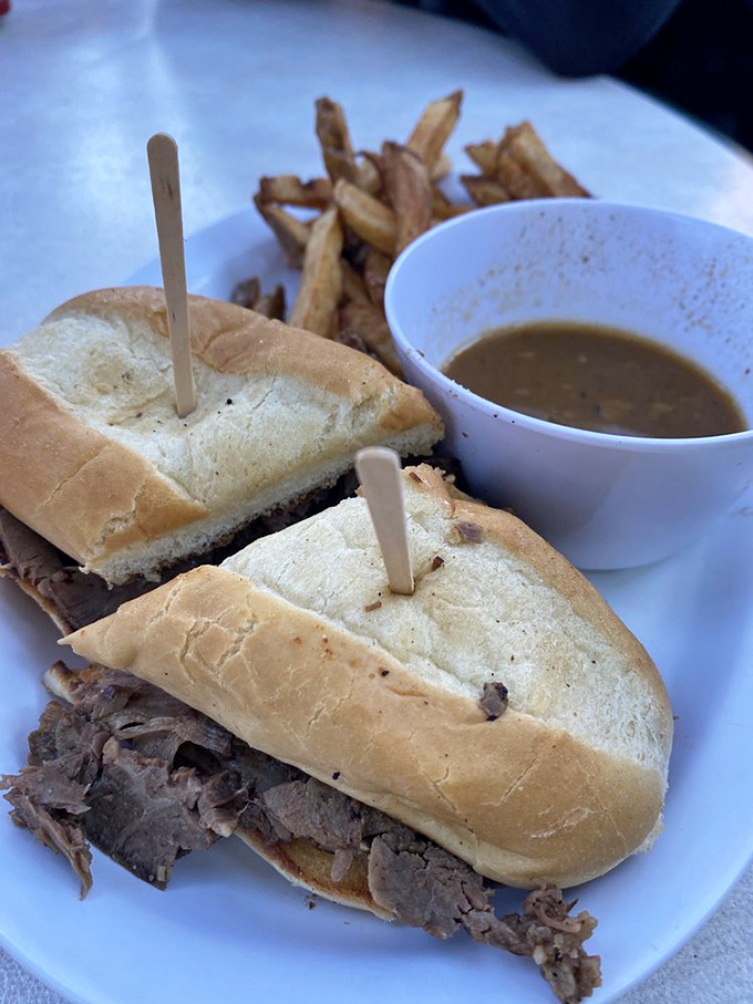 A brisket sandwich that doesn't need fancy presentation to tell you it means business, with a side of au jus for good measure.