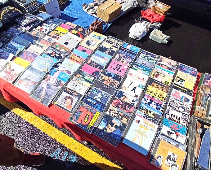 Musical time machines arranged in neat rows. Each album cover a portal to first kisses, road trips, and haircuts we'd rather forget.