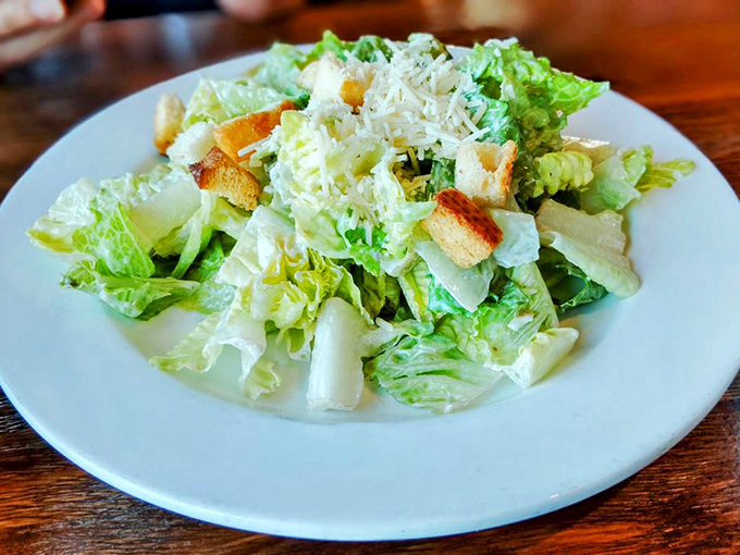 Even the Caesar salad gets the coastal treatment&mdash;crisp romaine, shaved parmesan, and croutons that crackle like waves on shore.