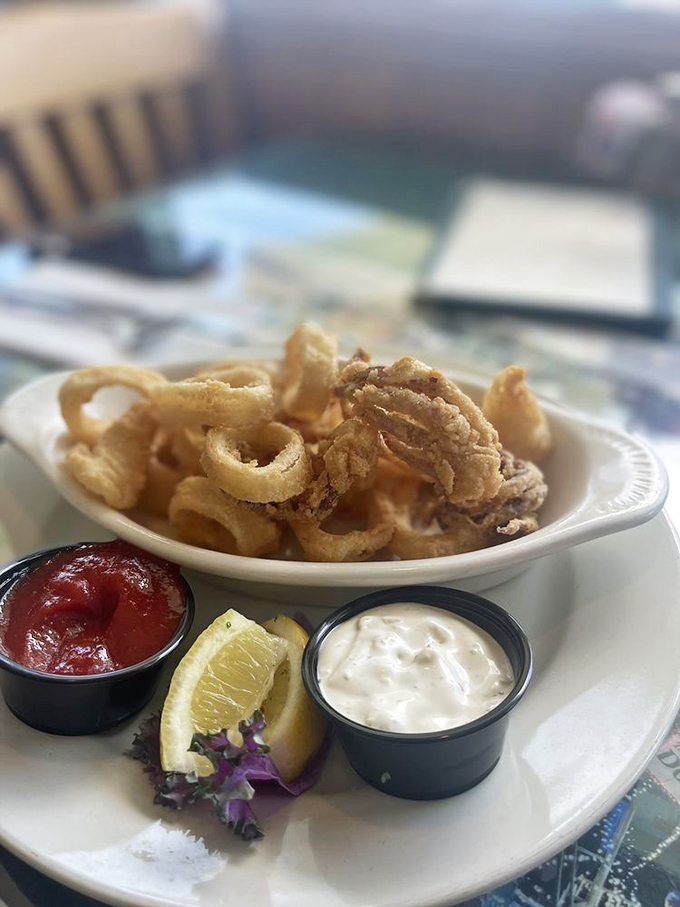 Crispy calamari that doesn't require the jaw strength of a sea lion &ndash; tender, light, and waiting for a dip in house-made sauces.