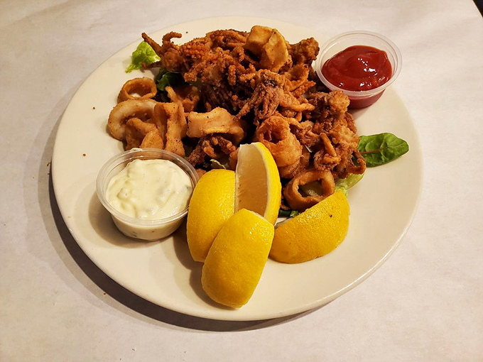 Fried calamari that ruins you for all other versions &ndash; crispy, tender, and served with lemon wedges that aren't just for decoration.
