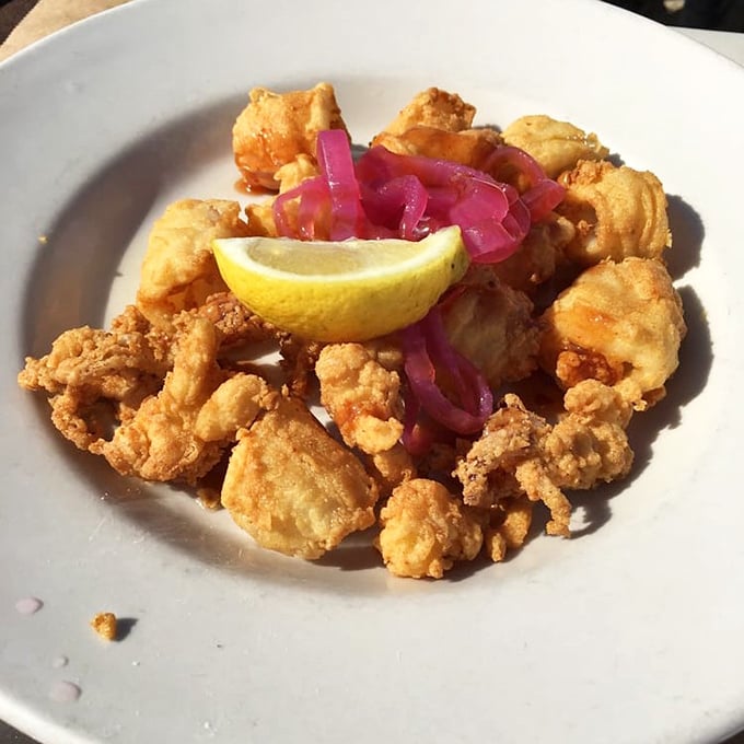 Calamari that's actually tender, not rubber bands in disguise, with pickled onions adding that perfect tangy counterpoint.