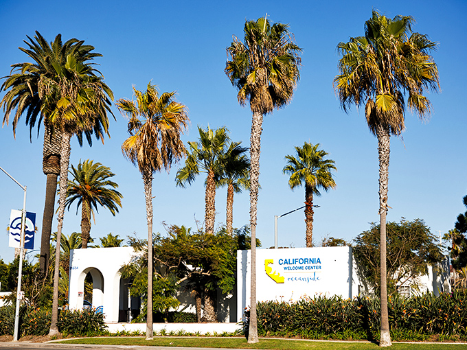 The California Welcome Center stands ready to guide visitors beneath swaying palms. This mission-style building offers maps, advice, and that warm SoCal hospitality.