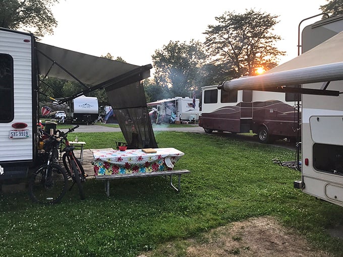 Sunset between campers creates that perfect "wish you were here" postcard moment. Camping: where strangers become neighbors and neighbors become friends.