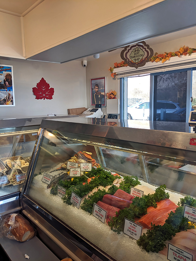 The fresh seafood display case showcases daily catches like edible jewels on crushed ice. 