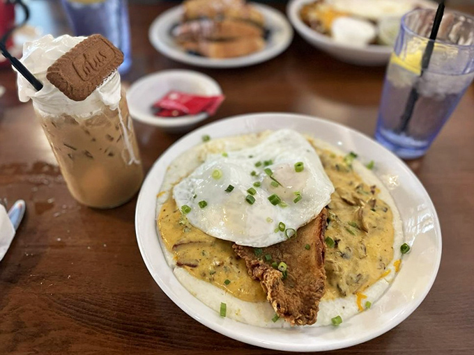 Southern comfort meets Chicago morning in this catfish and grits plate, topped with an egg that's ready for its close-up.