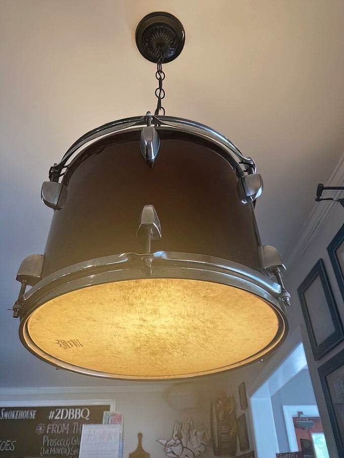 Even the lighting fixtures stay on theme – a drum chandelier that reminds you this place marches to its own delicious beat.