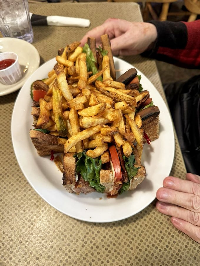 The club sandwich reimagined &ndash; layers of goodness stacked high between toasted bread with fries that could steal the spotlight if given half a chance.