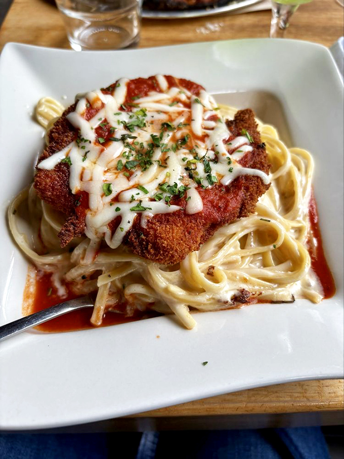 Chicken Parmesan that could make an Italian grandmother weep with joy. The golden crust and melted cheese blanket promise comfort in every forkful.