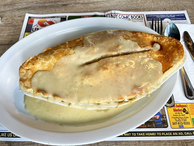 Comfort food that defies categorization&mdash;an omelet that's draped itself luxuriously over a medley of breakfast potatoes and savory fillings.