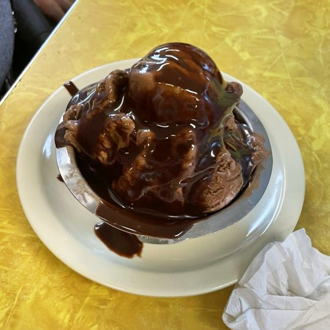 Chocolate ice cream drowning in hot fudge and walnuts&mdash;proof that sometimes more is more, and moderation is highly overrated.