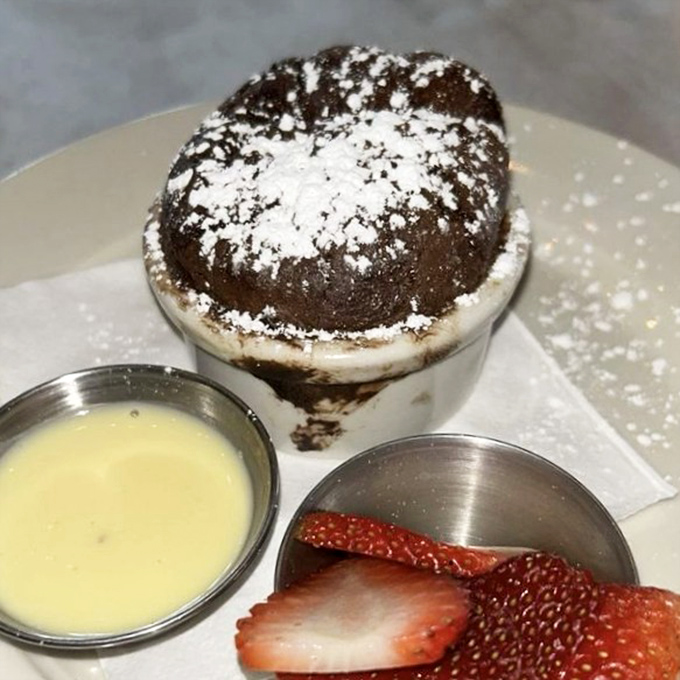 A chocolate souffl&eacute; that rises to the occasion, served with cr&egrave;me anglaise and strawberries. Worth the 20-minute wait and every calorie.